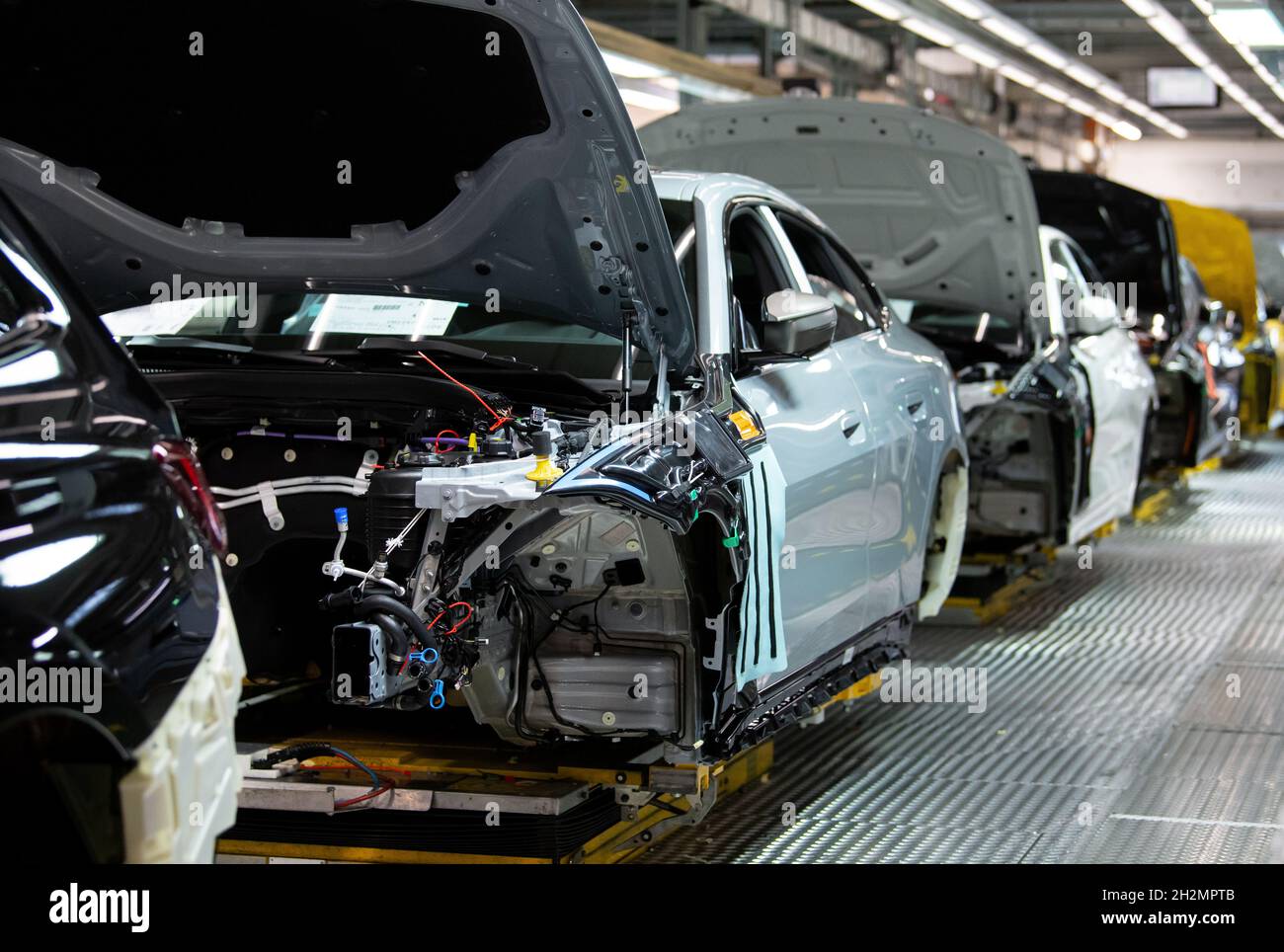 Munich, Germany. 22nd Oct, 2021. Various BMW models run along a ...