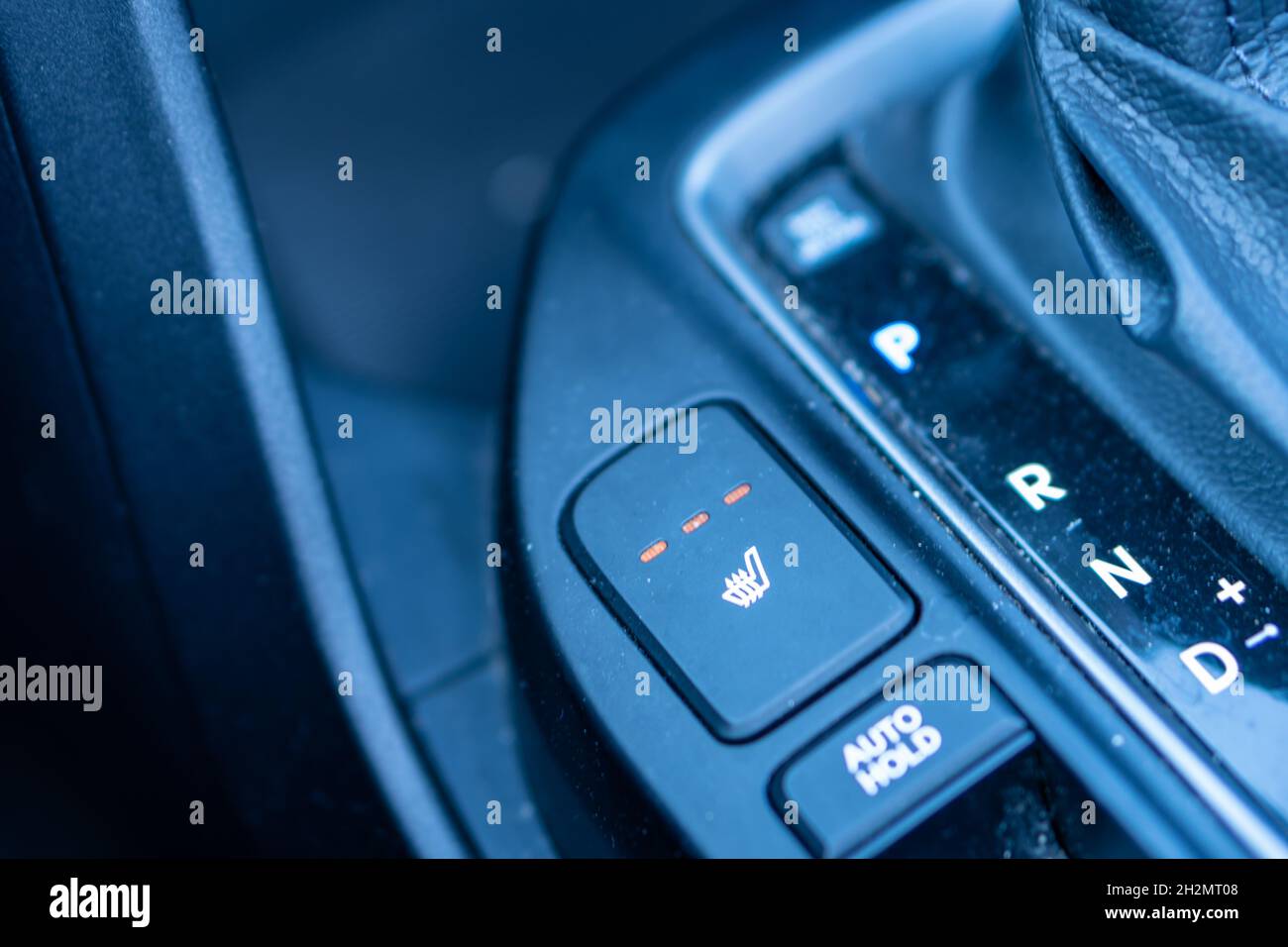 Modern interior of an automobile with the buttons near the gear leveler ...