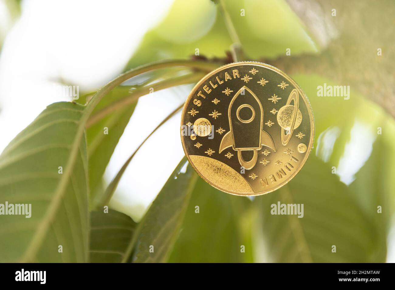 Stellar digital crypto currency. Stack of silver coins. Cyber money ...