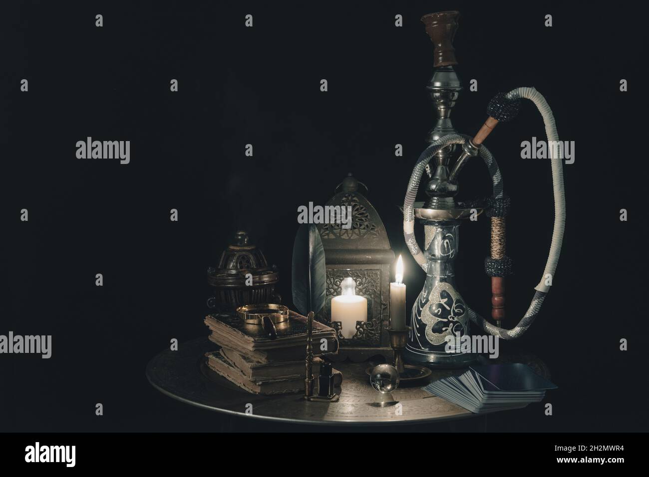 Shisha hookah together with book with candles. shisha concept Stock ...
