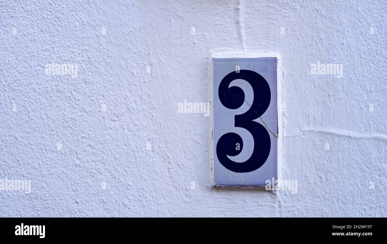 ceramic house number table. number: 3. on a white background Stock ...