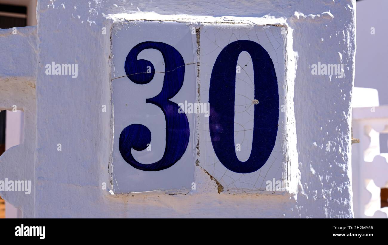 ceramic house number table. number: 30. on a white background Stock ...