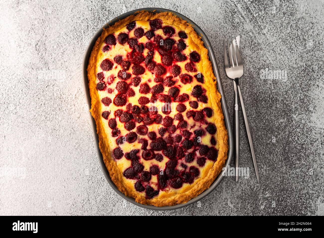 Raspberry pie with curd filling in an oval shape, top view Stock Photo ...
