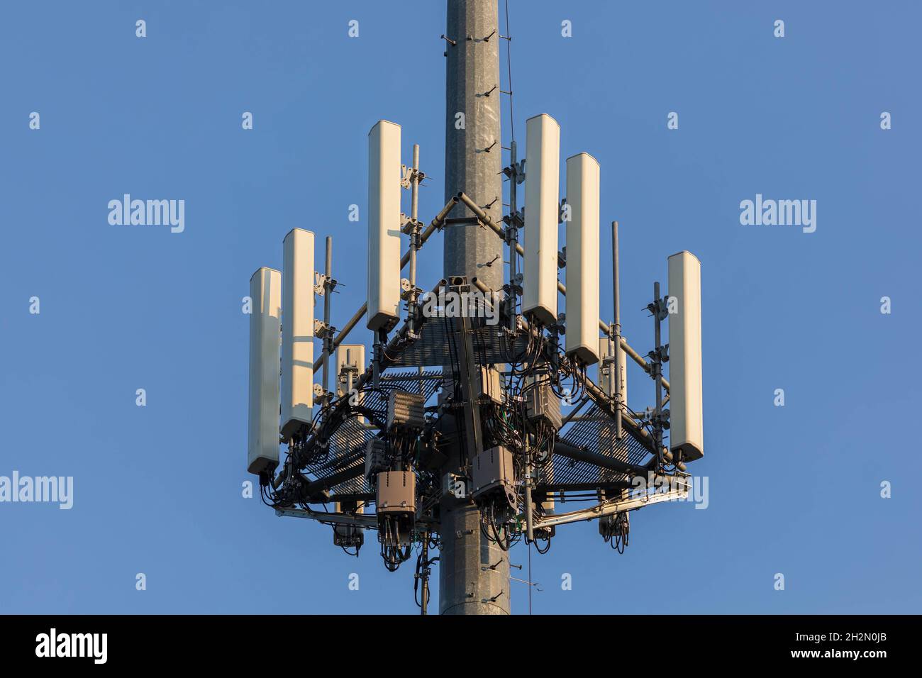 a close up of a cell phone tower as sunset approached Stock Photo - Alamy