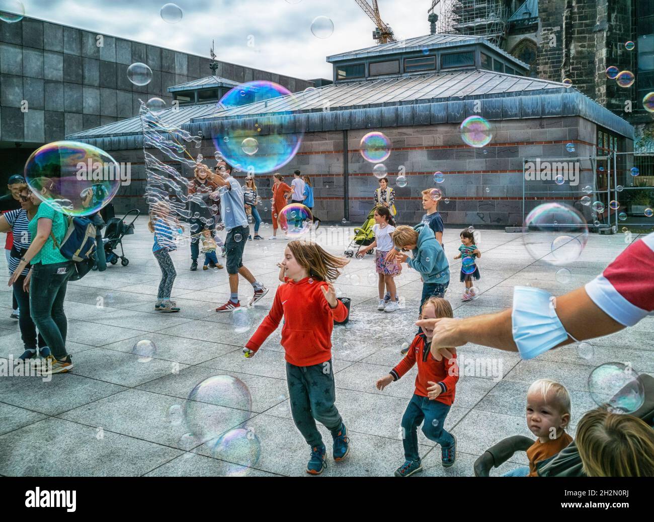 Cologne, Germany - September 11, 2021: Children having fun with soap ...