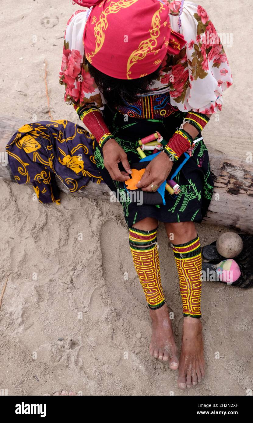 An indigenous woman from the Guna people wearing traditional beaded leg ...