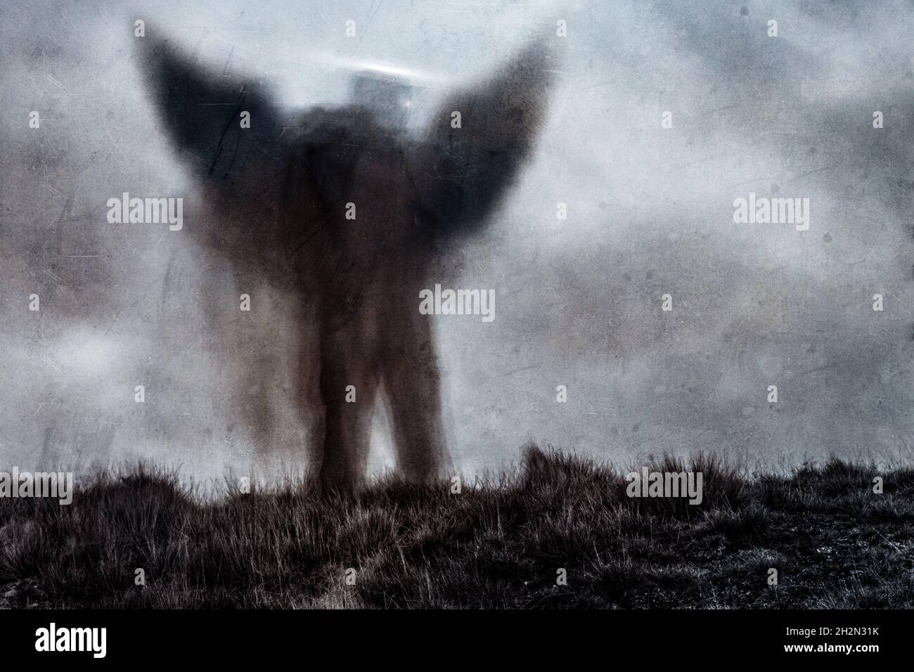 A horror, spiritual concept of a scary angel figure with glowing eyes ...