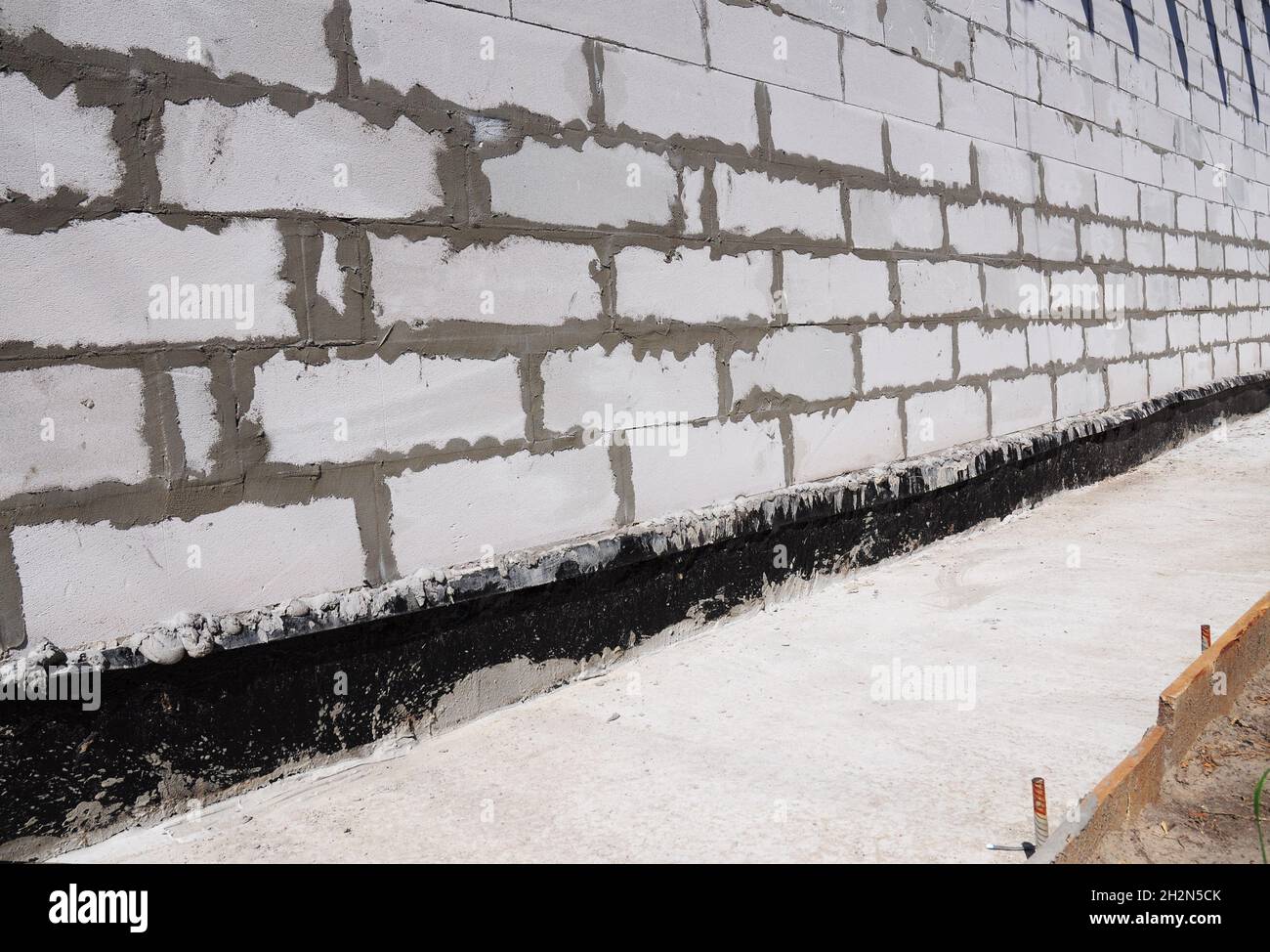 Waterproofing and insulationhouse foundation wall. Waterproofing house ...
