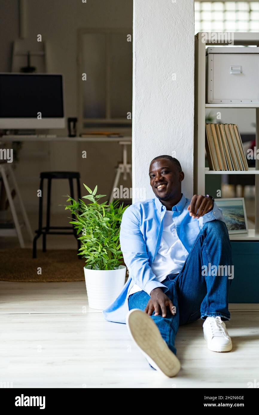 Relaxing man sitting on sofa hi-res stock photography and images - Alamy