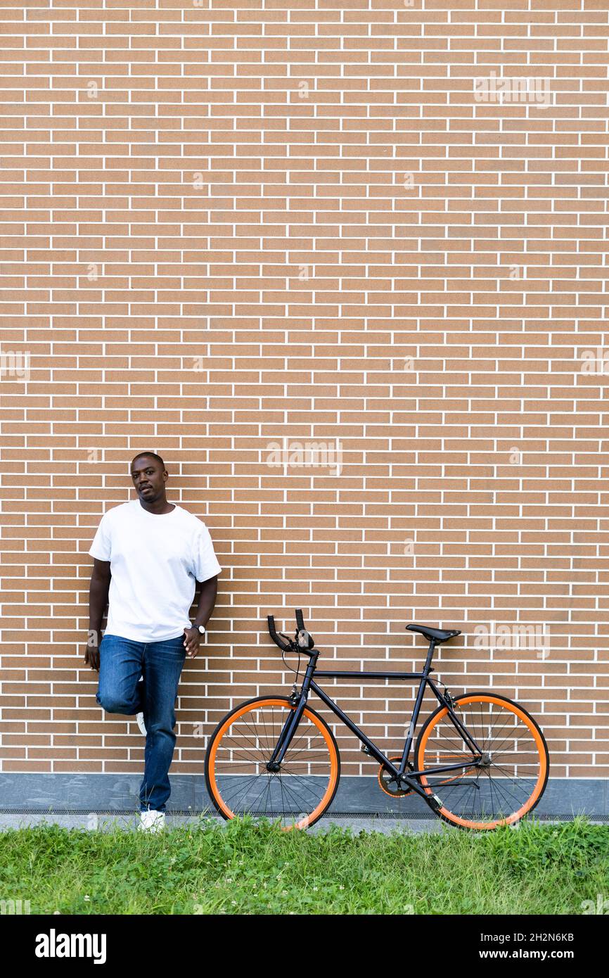 African american man standing bike hi-res stock photography and images ...