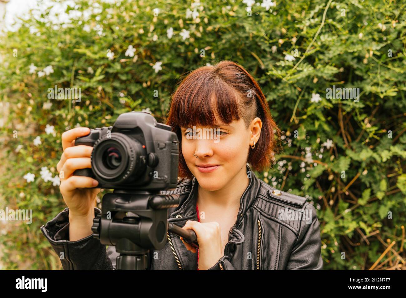 Smiling female photographer camera hi-res stock photography and images ...