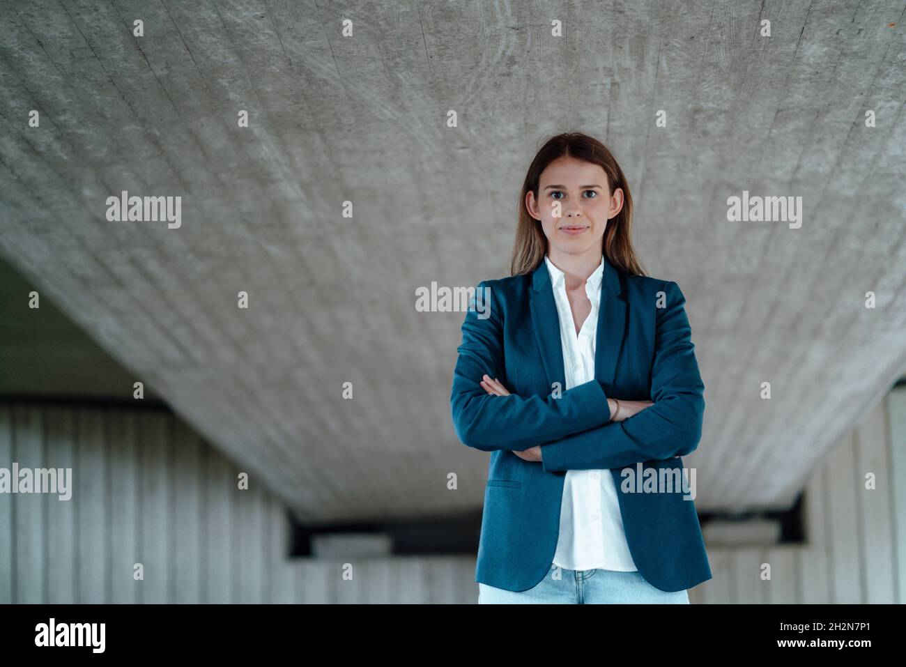 Female professional holding mobile phone at basement Stock Photo - Alamy