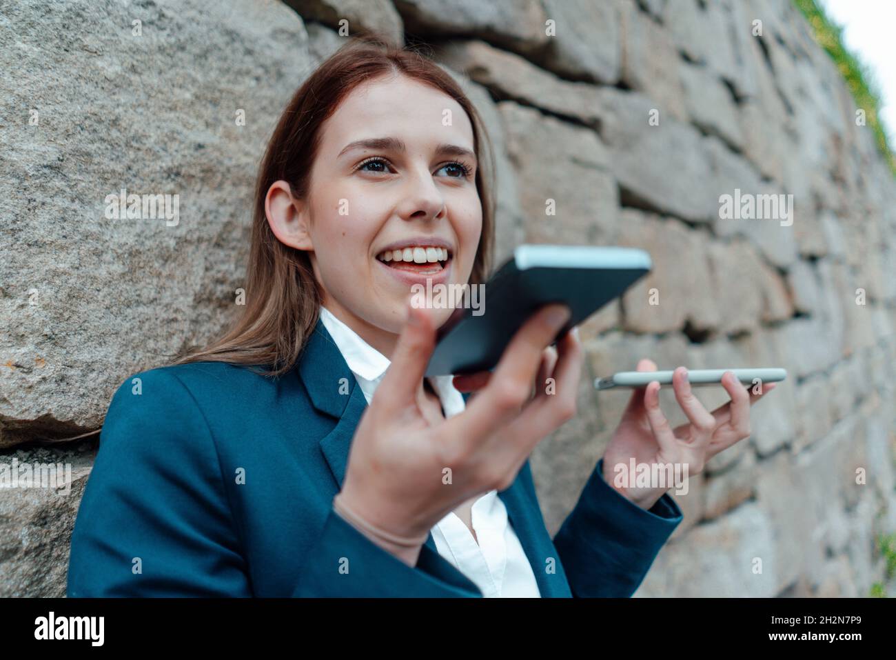 Female professional with mobile phone in basement Stock Photo - Alamy