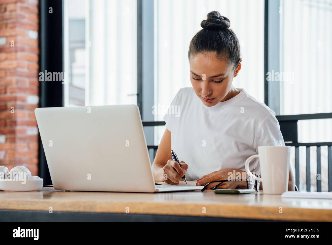 Adult female sitting writing hi-res stock photography and images - Alamy