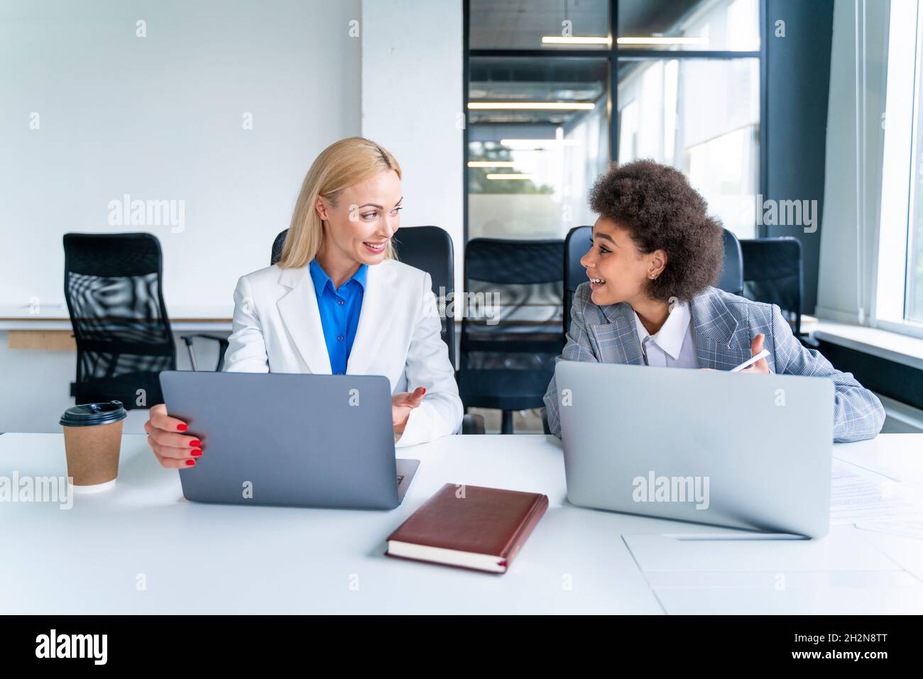 Employee having online discussion coworker hi-res stock photography and ...