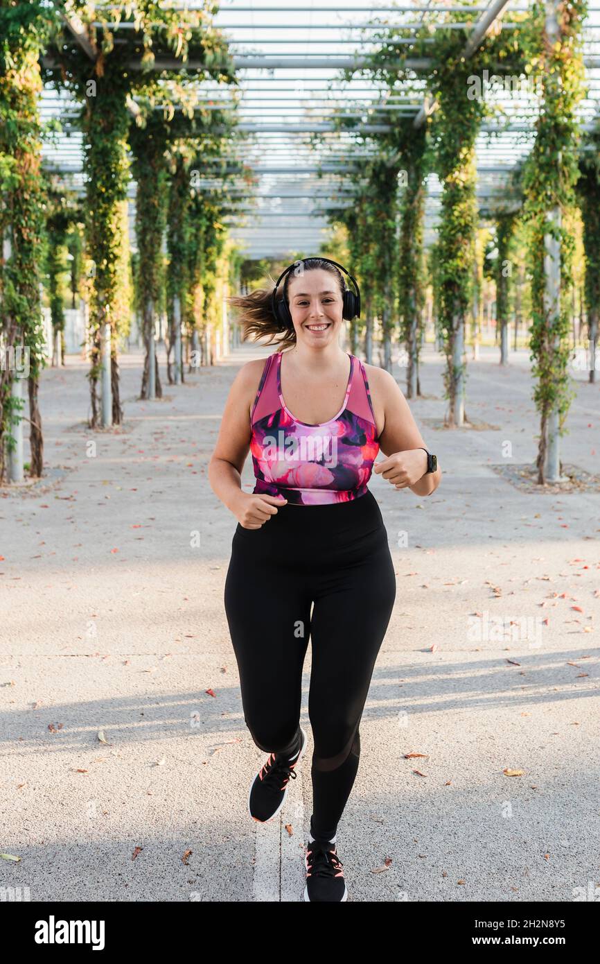 Curvy woman running hi-res stock photography and images - Alamy