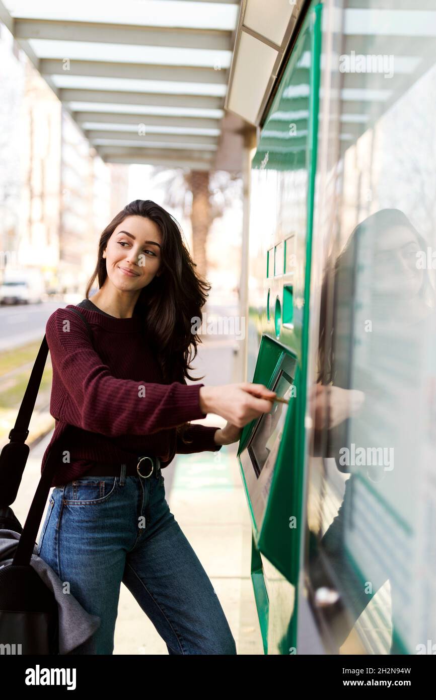 Woman commuter touchscreen ticket hi-res stock photography and images ...