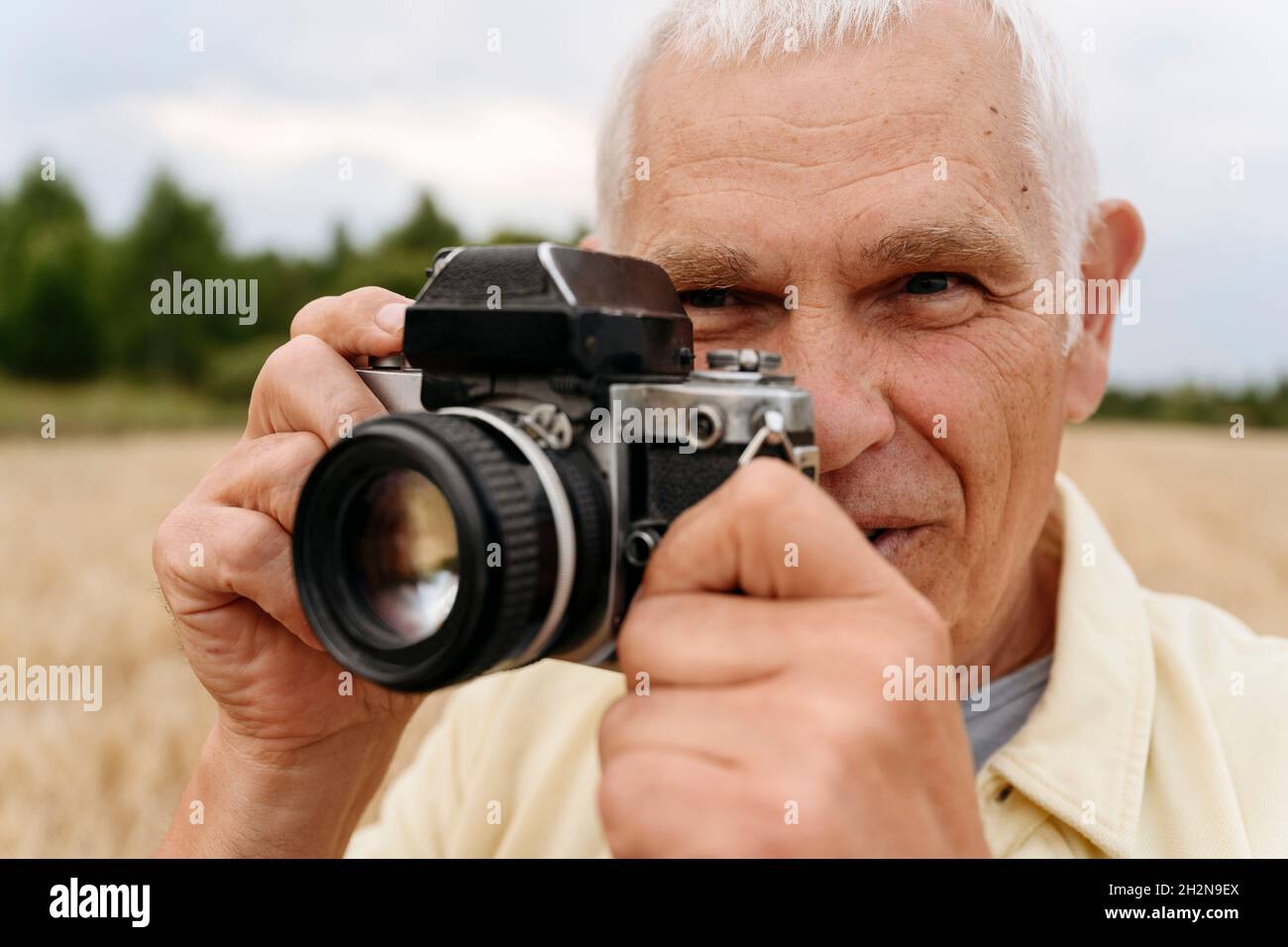 Happy family walking on wheat field Stock Photo - Alamy
