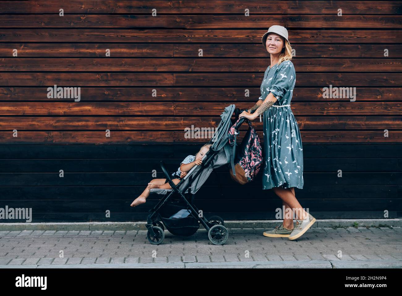 Woman pushing pram hi-res stock photography and images - Alamy