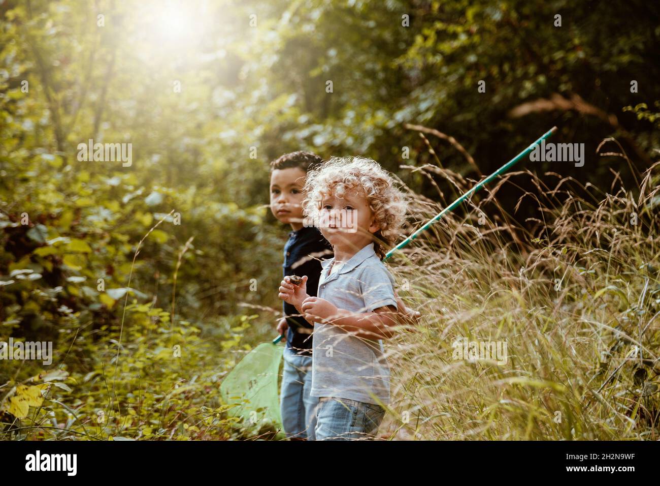 Two boys standing side side hi-res stock photography and images - Alamy