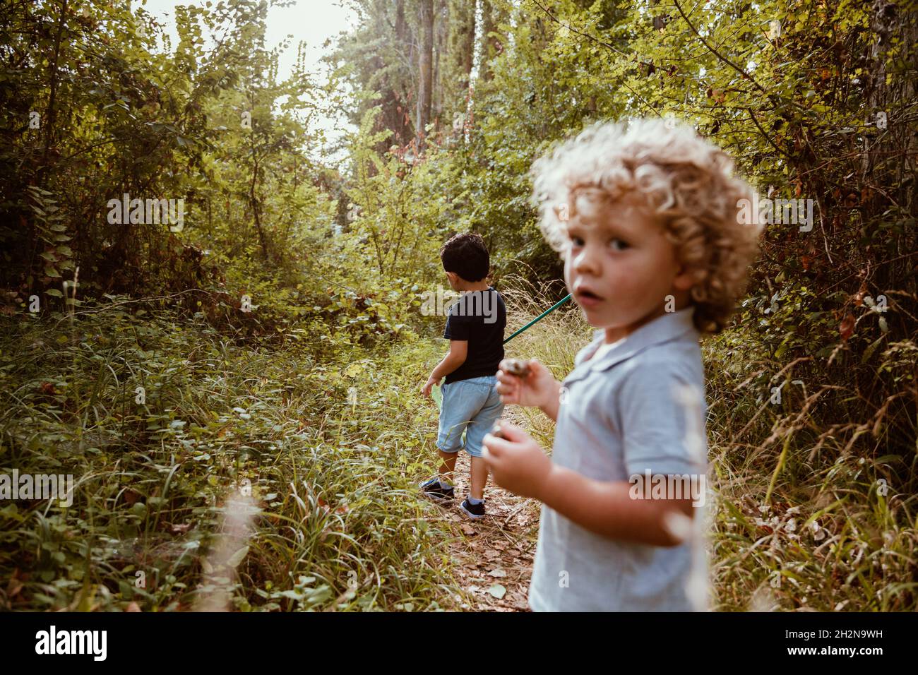 Boys walking hi-res stock photography and images - Alamy