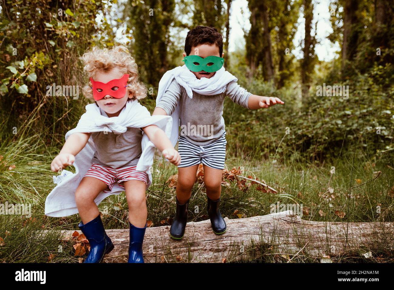 Two boys playing in forest 2 3 years hi-res stock photography and ...
