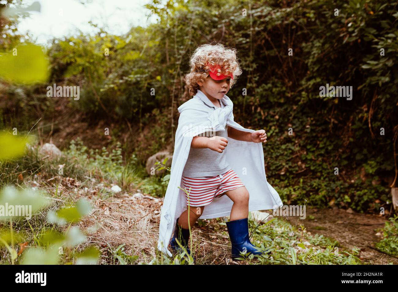 Boy wearing cape hi-res stock photography and images - Alamy