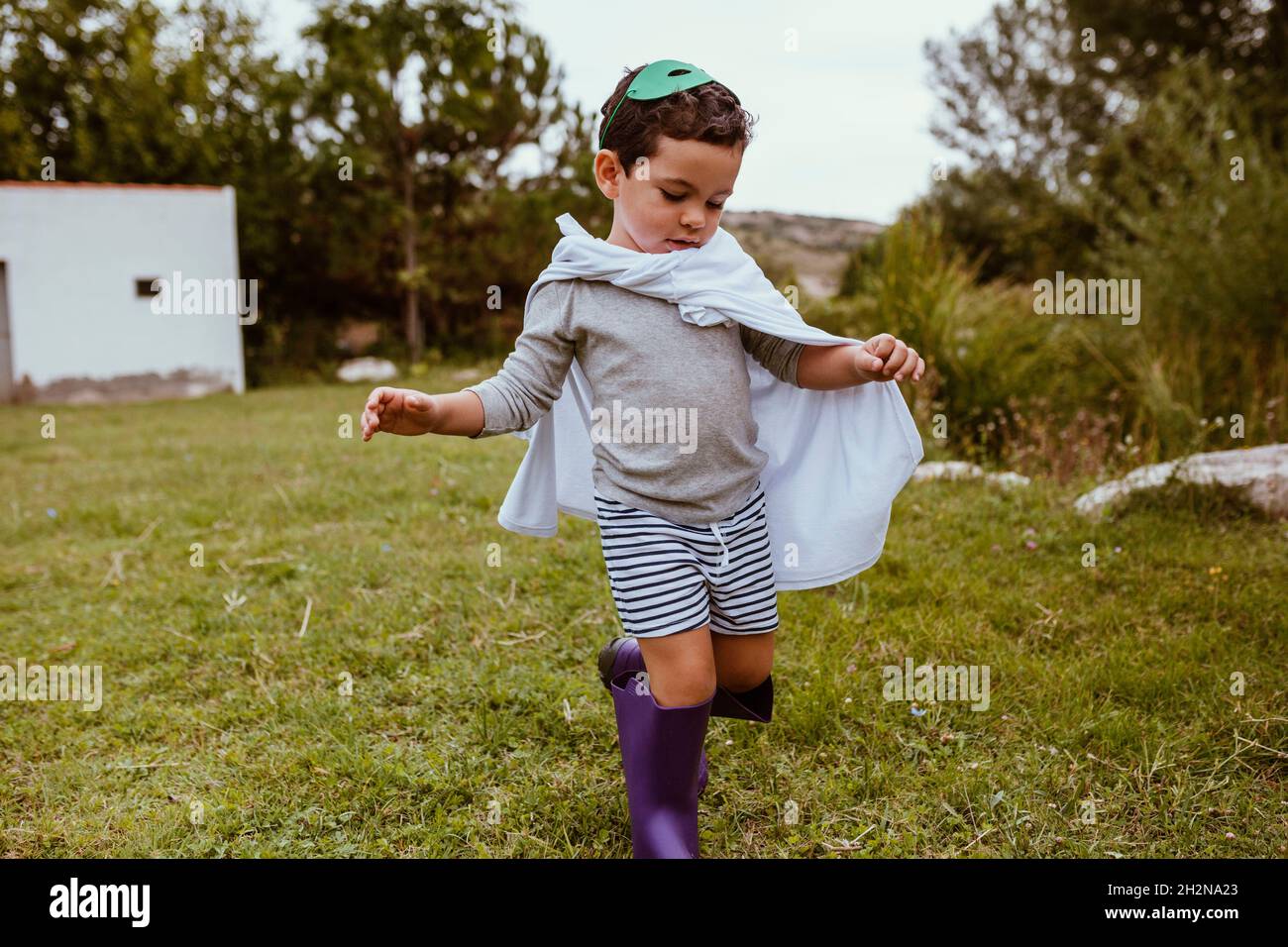 Boy wearing cape hi-res stock photography and images - Alamy