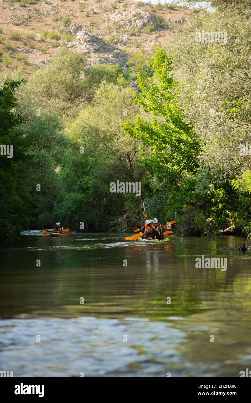 Group of friends are canoeing in the forest with beautiful nature Stock ...