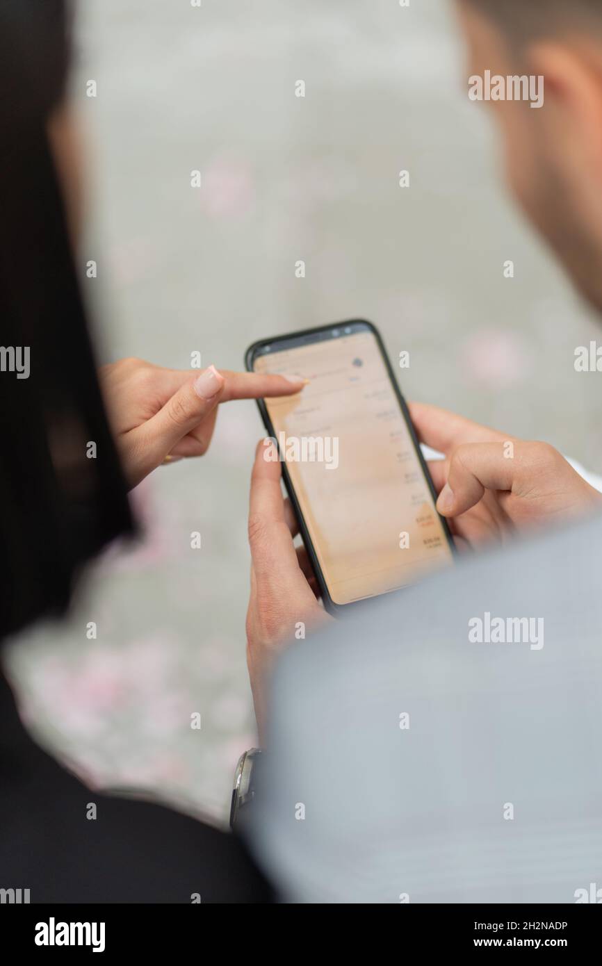Two business people are checking the phone Stock Photo - Alamy