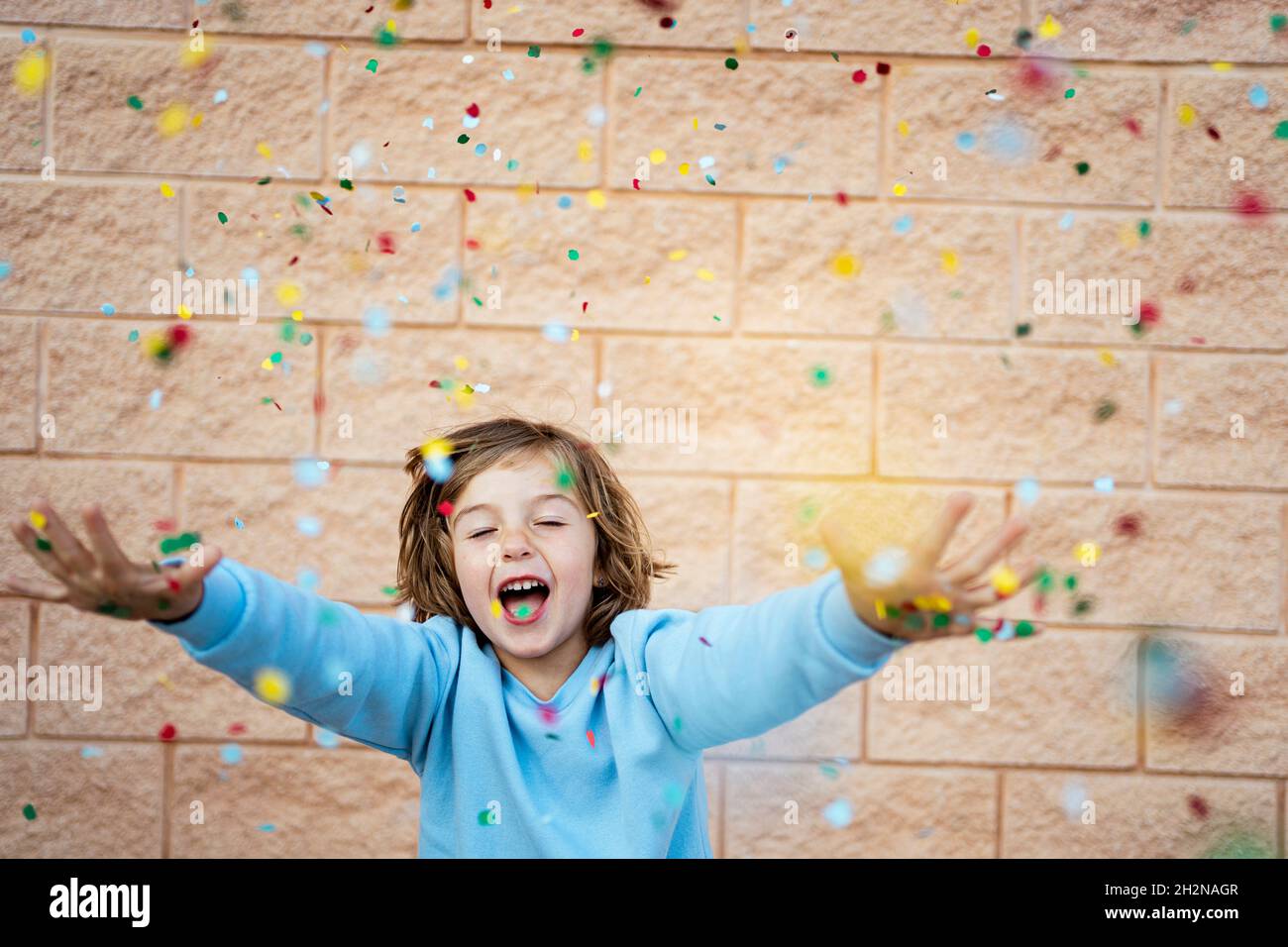 Girl throwing confetti hi-res stock photography and images - Alamy