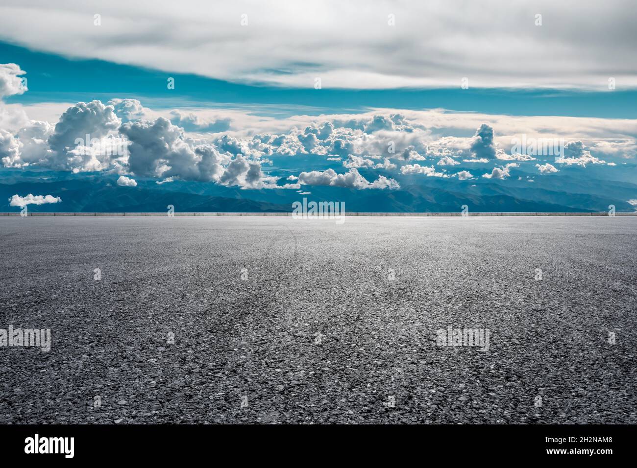 Empty race track and mountain with sky clouds landscape Stock Photo - Alamy