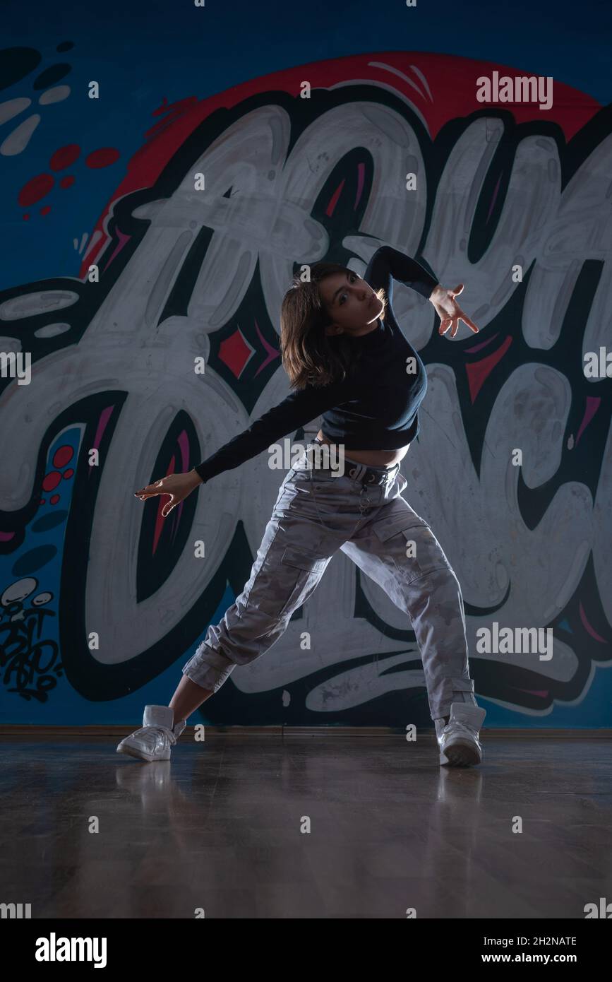 Silhouette of young woman hiphop dancer (breakdancer)dancing on ...