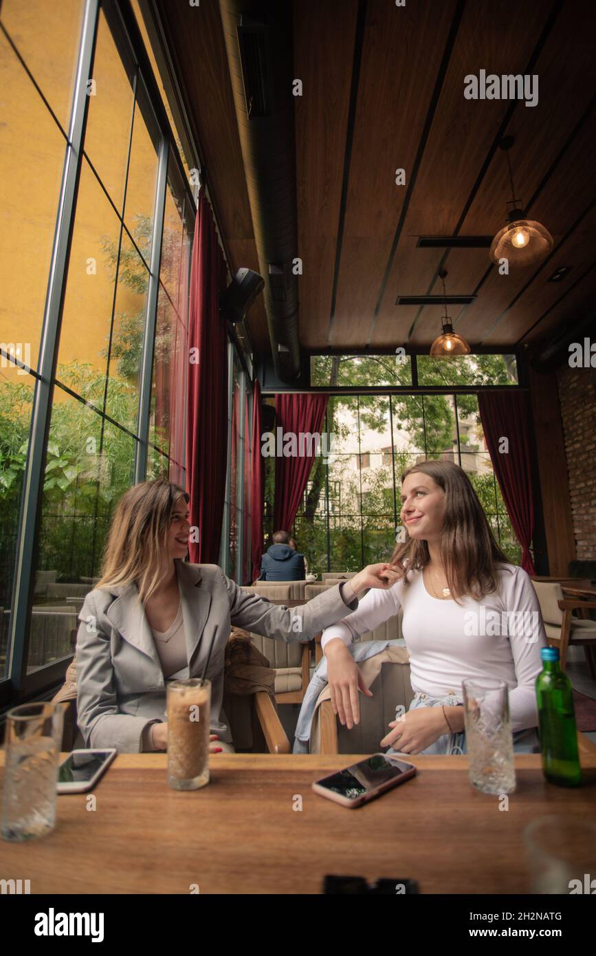 Amazing adn beautiful girl is giving her sister a compliments while ...