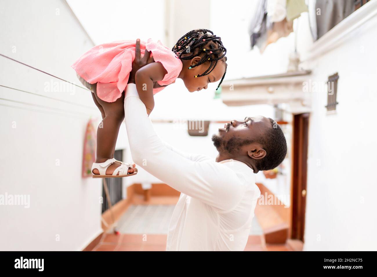 Man lifting female child up hi-res stock photography and images - Alamy