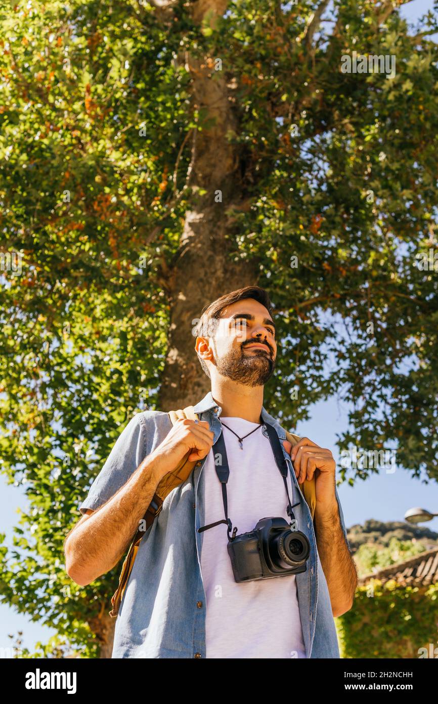 Man standing under tree hi-res stock photography and images - Alamy