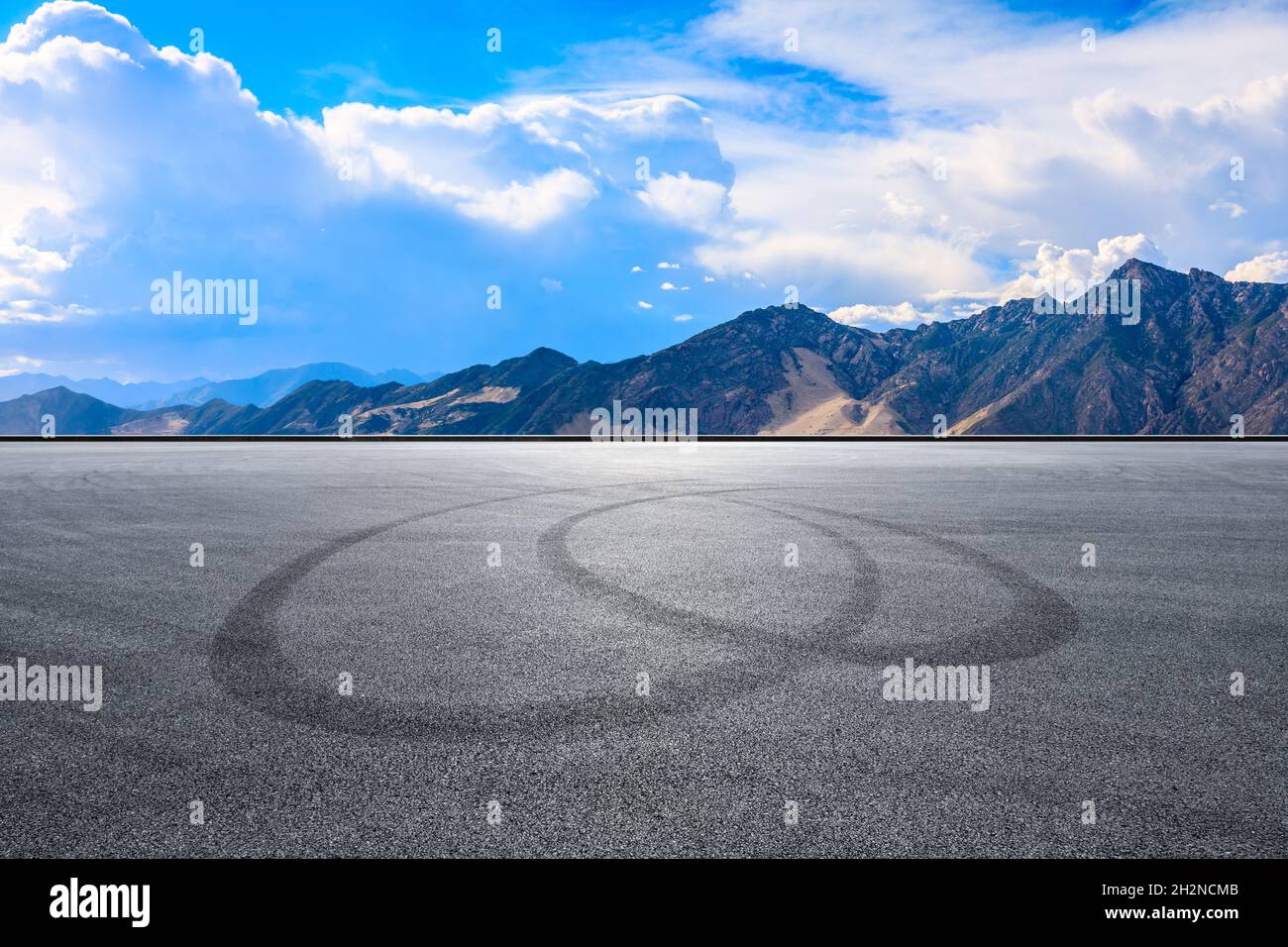 Empty race track and mountain with sky clouds landscape Stock Photo - Alamy