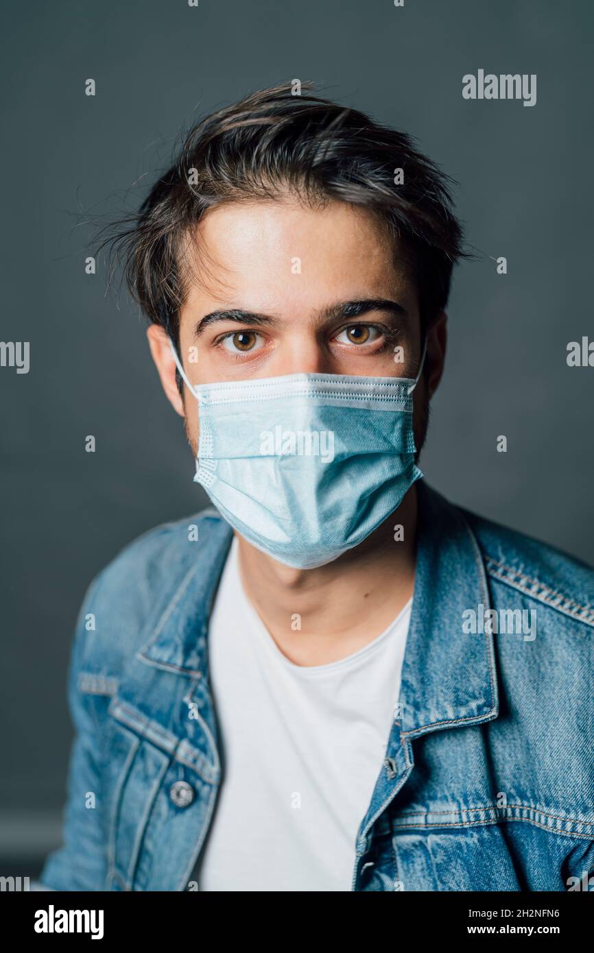 Covid mask young man portrait hi-res stock photography and images - Alamy
