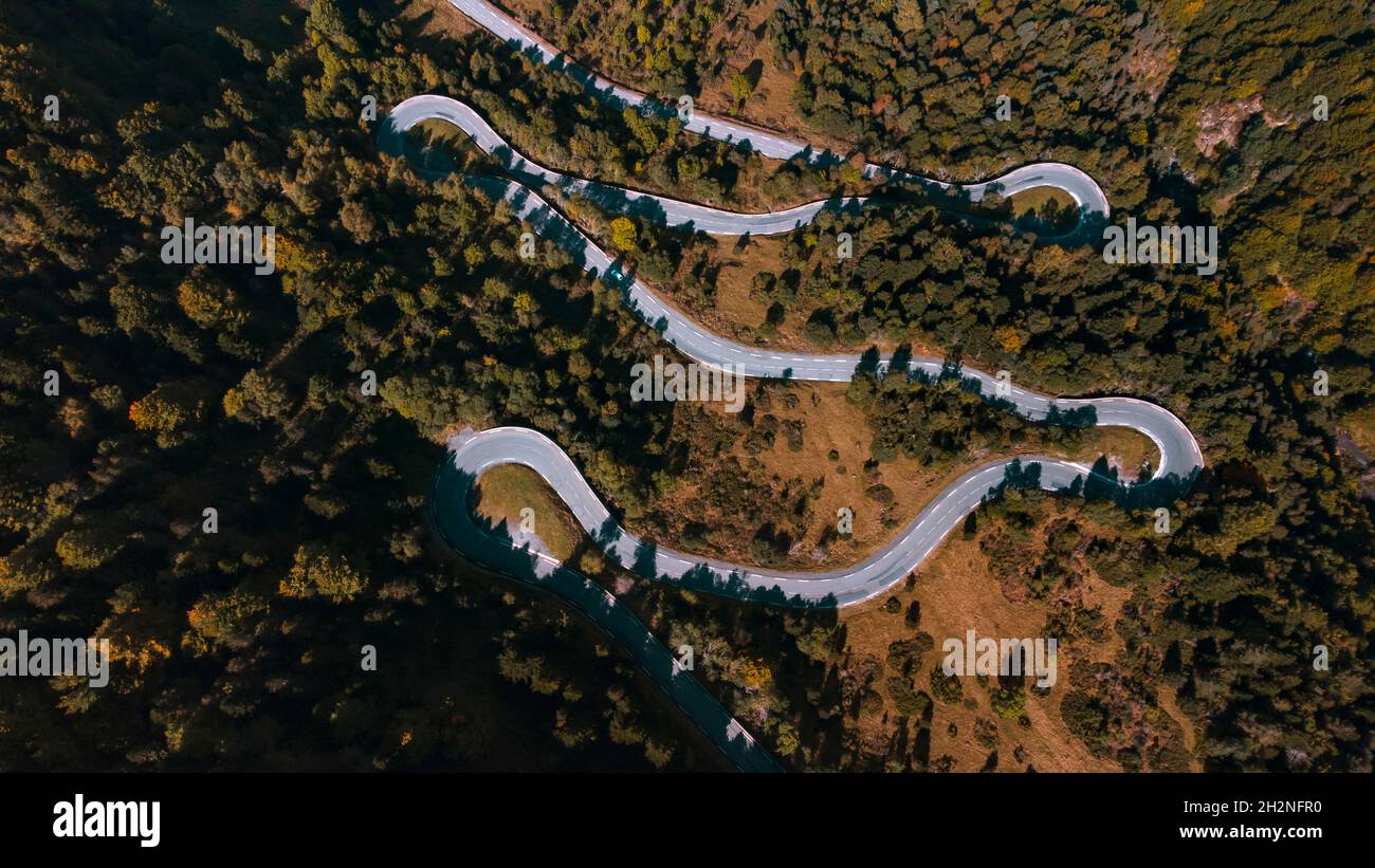 Aerial view of winding mountain road in autumn Stock Photo - Alamy