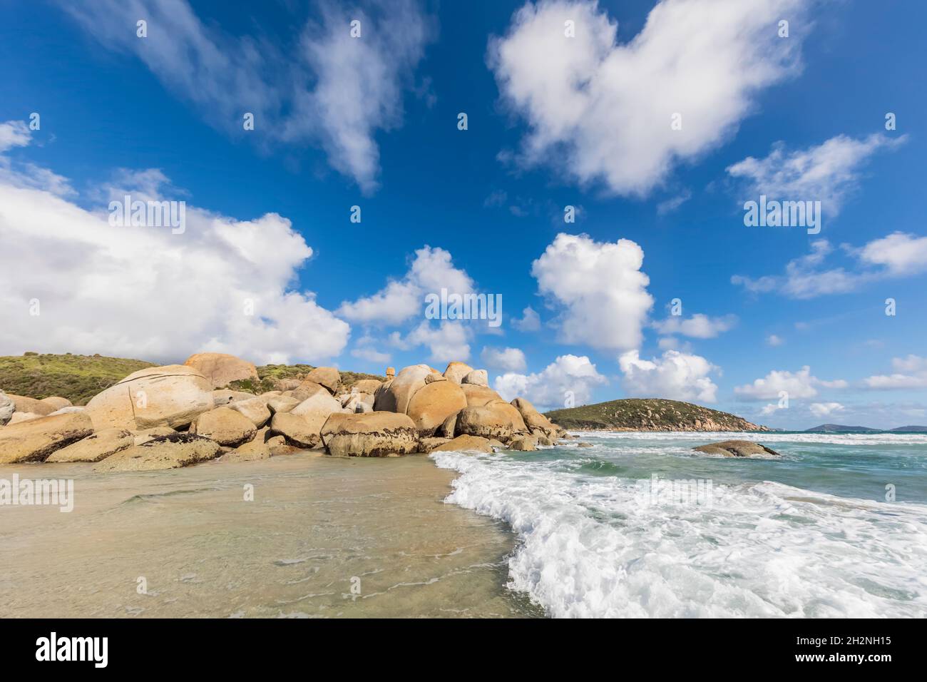 Boulders on sandy coastal beach in summer, Australia Stock Photo - Alamy