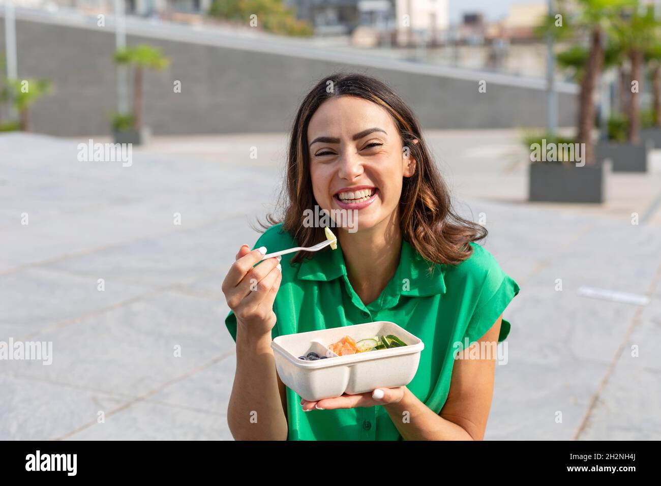 View woman eating poke bowl hi-res stock photography and images - Alamy