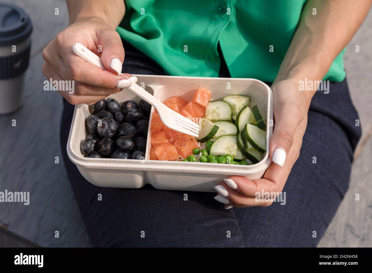 View woman eating poke bowl hi-res stock photography and images - Alamy
