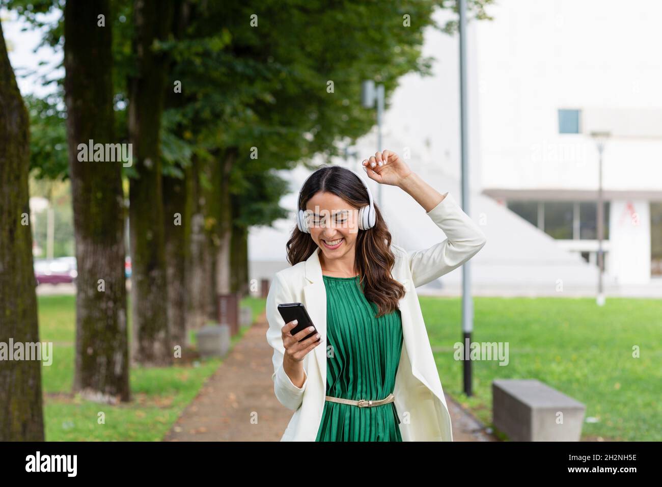 Happy woman dancing mobile phone hi-res stock photography and images ...