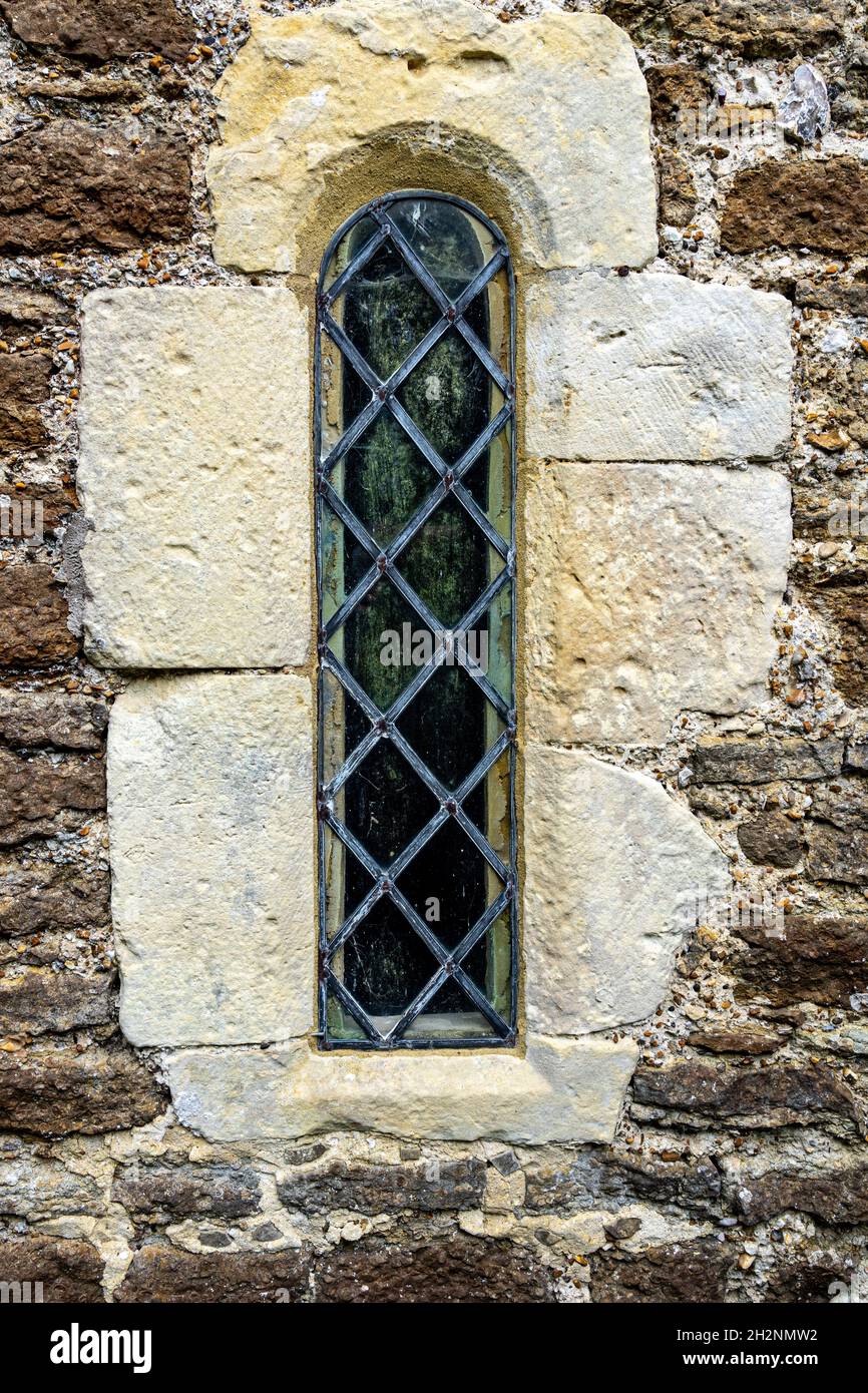 Narrow leaded light window in church wall Stock Photo - Alamy