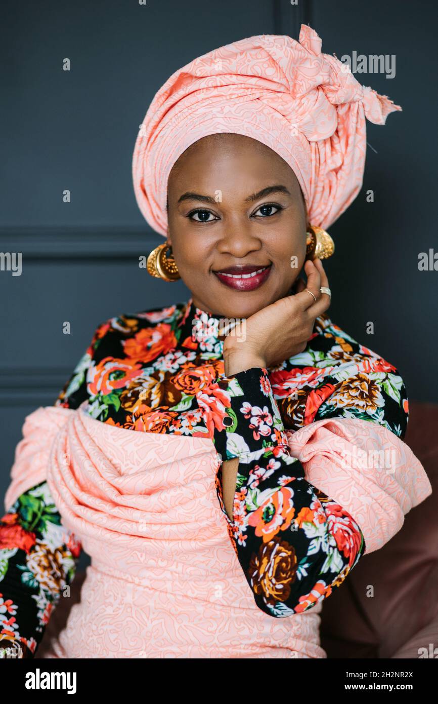 Studio close up portrait of African woman with bright makeup and ...