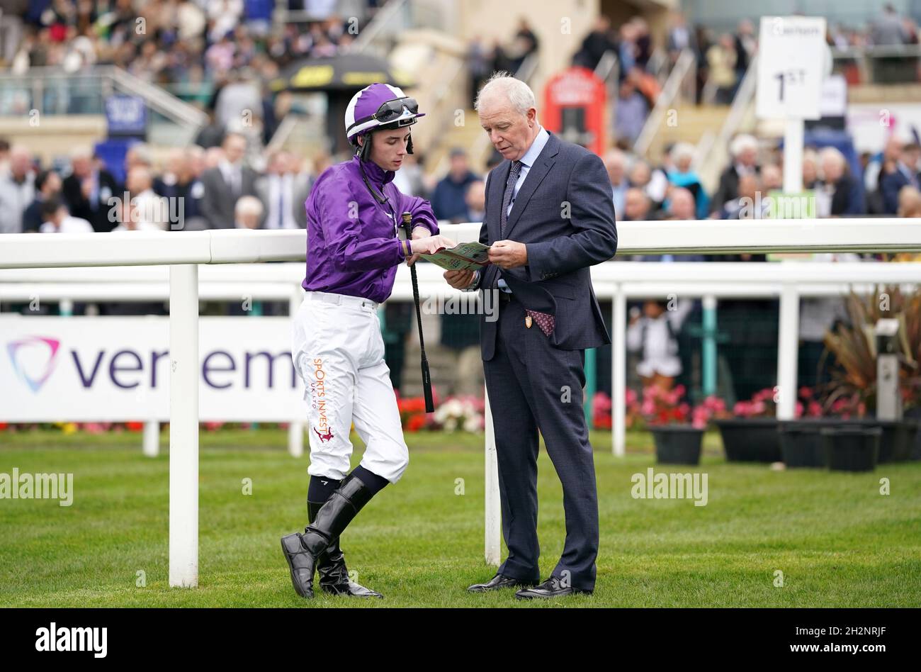 Jockey Rossa Ryan speaks with trainer Karl Burke in the parade ring ...