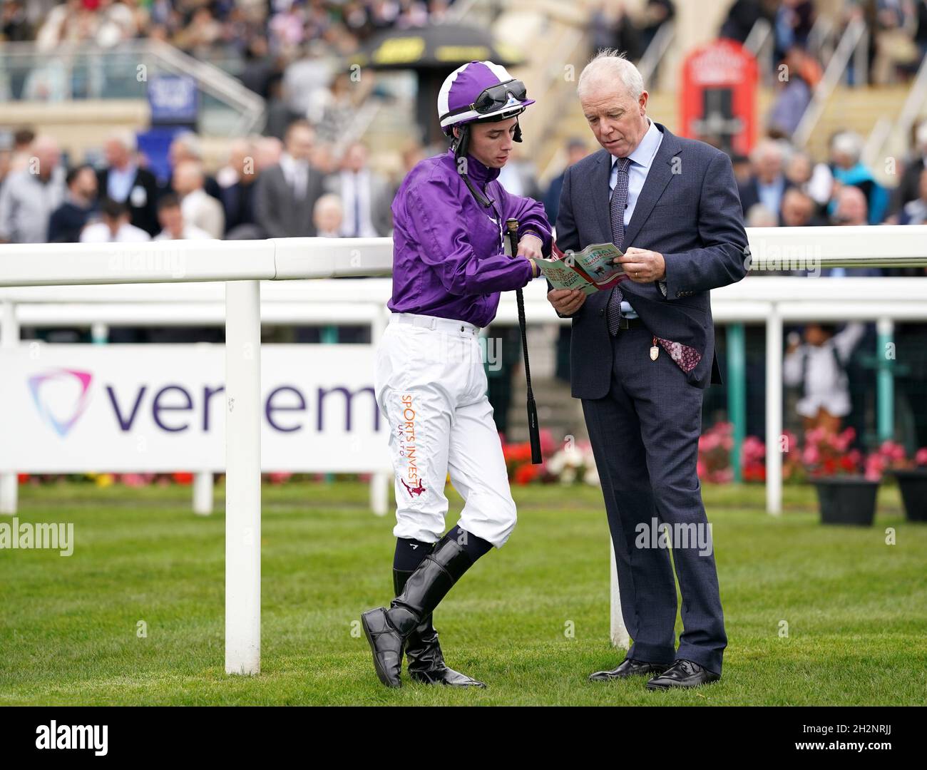 Jockey Rossa Ryan speaks with trainer Karl Burke in the parade ring ...