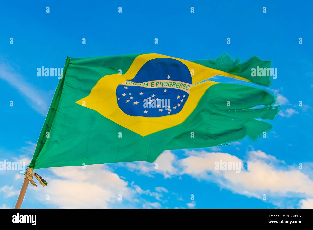 Brazilian flag waving in the wind with blue sky in the background in ...
