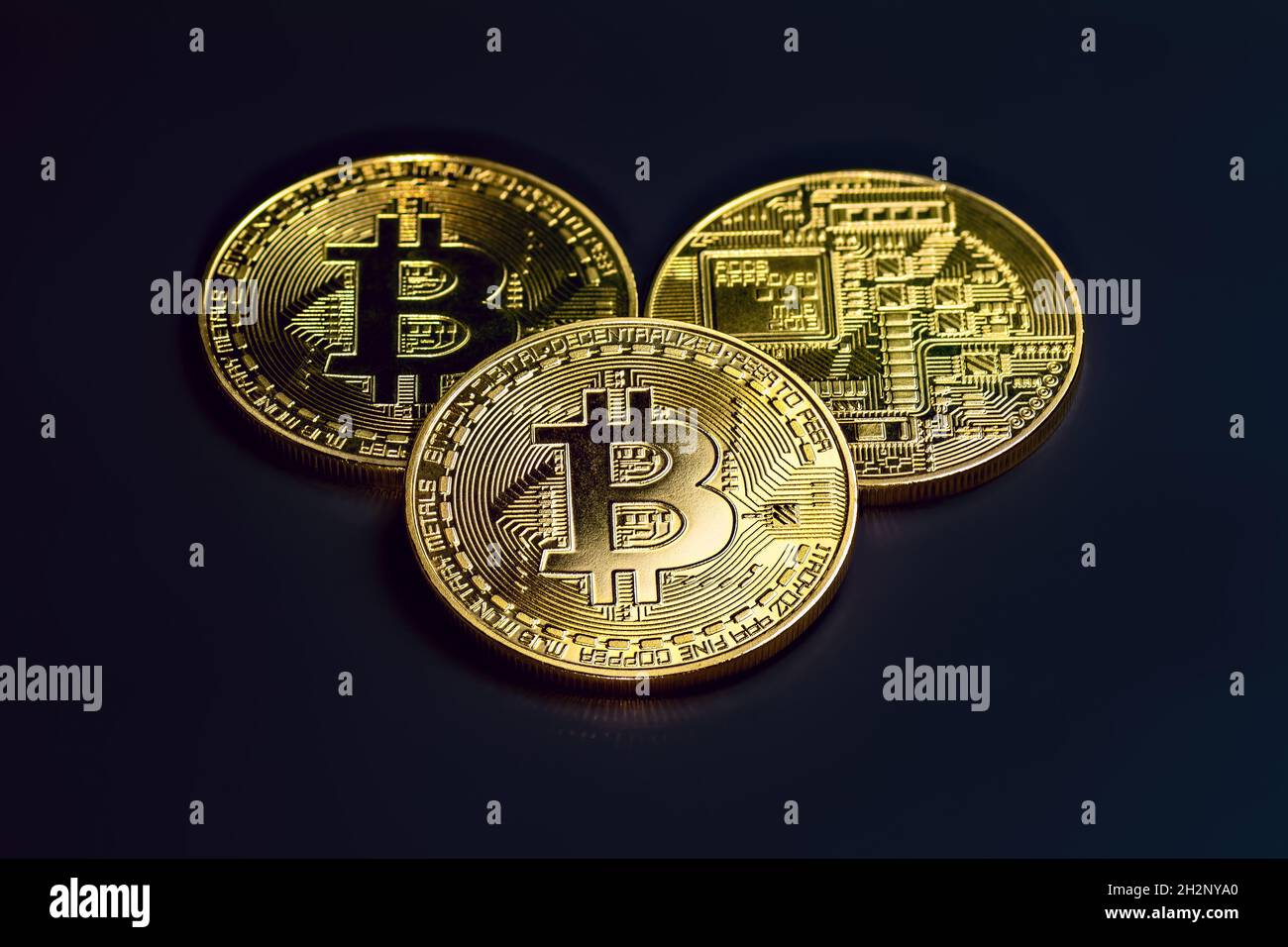 Golden bitcoin coins (BTC) on dark background top view. Virtual money ...