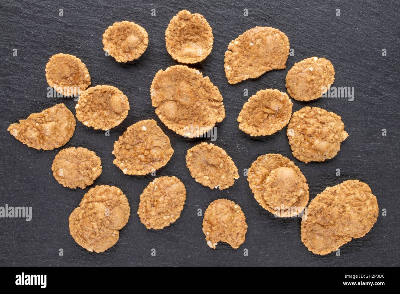Delicious multi-grain flakes on a slate board, close-up, top view Stock ...